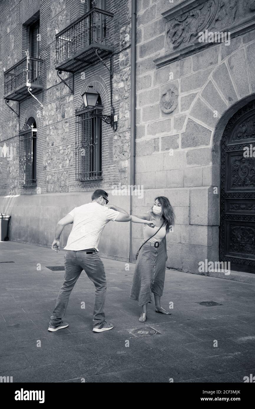 Safer way of greeting in the New Normal. Man and woman foot shaking and ...