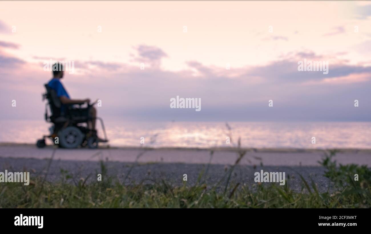 Handicapped wheelchair sea sunset hi-res stock photography and images ...