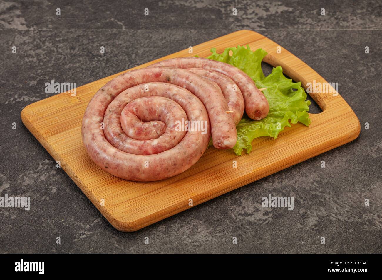 Raw pork sausage ring for grill Stock Photo - Alamy