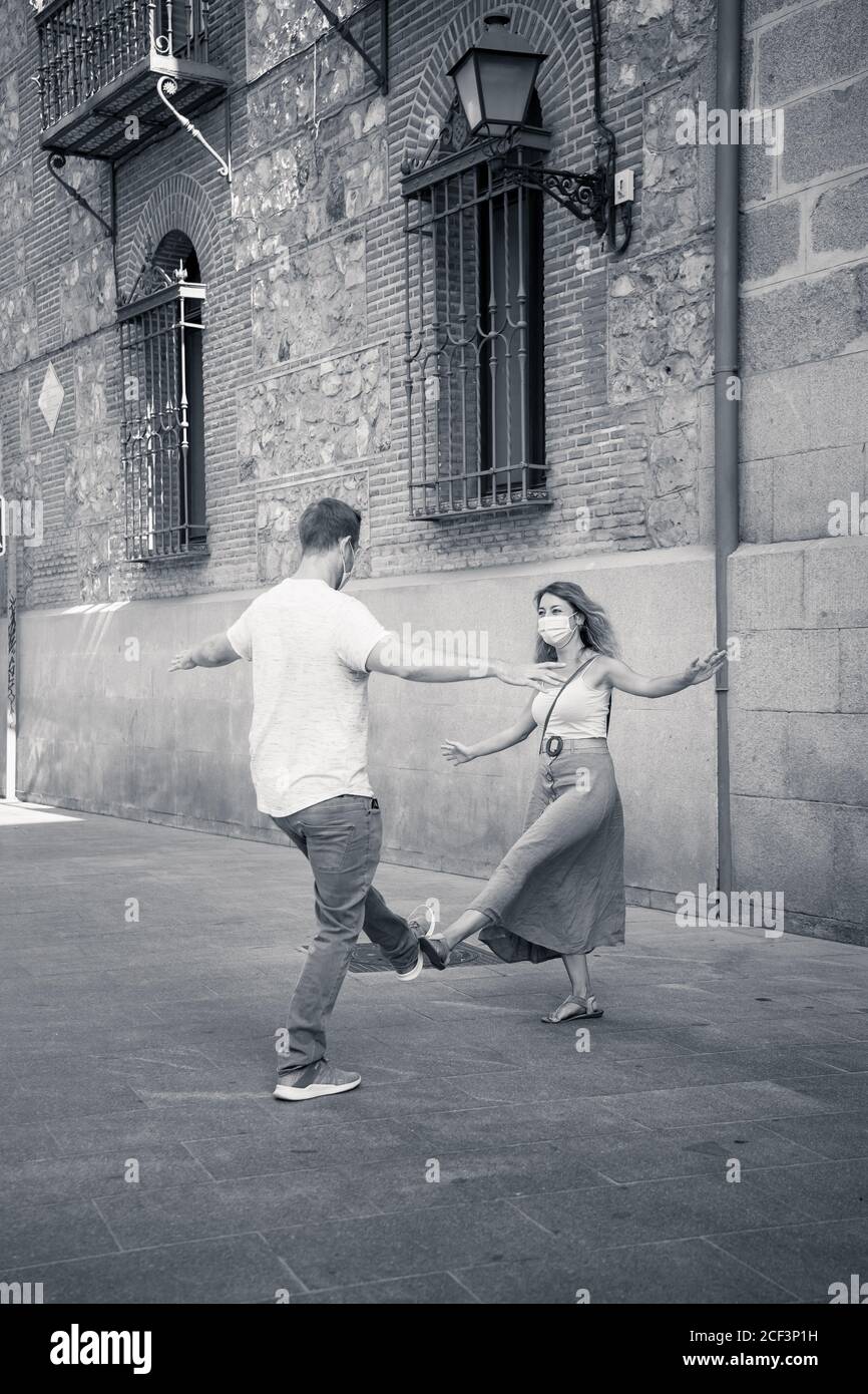 Safer way of greeting in the New Normal. Man and woman foot shaking and ...