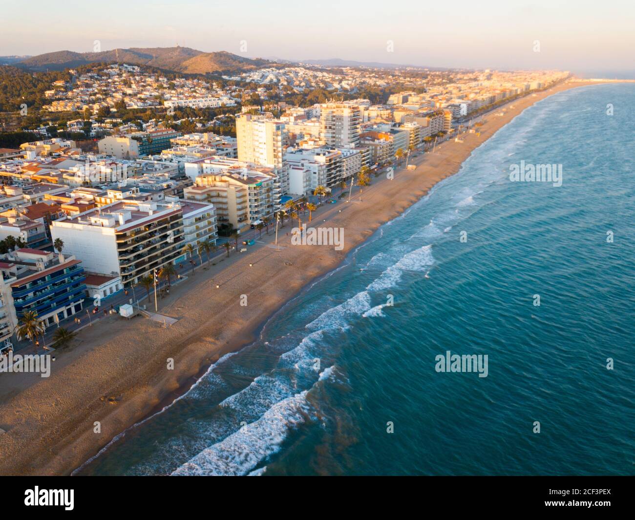 Picturesque view of Calafell cityscape with famous sand beach on ...