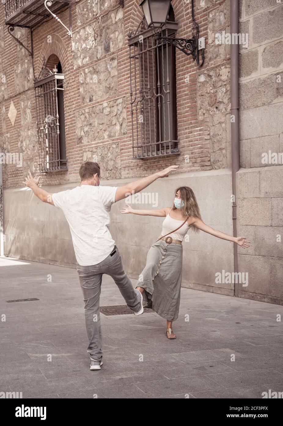 Safer way of greeting in the New Normal. Man and woman foot shaking and ...