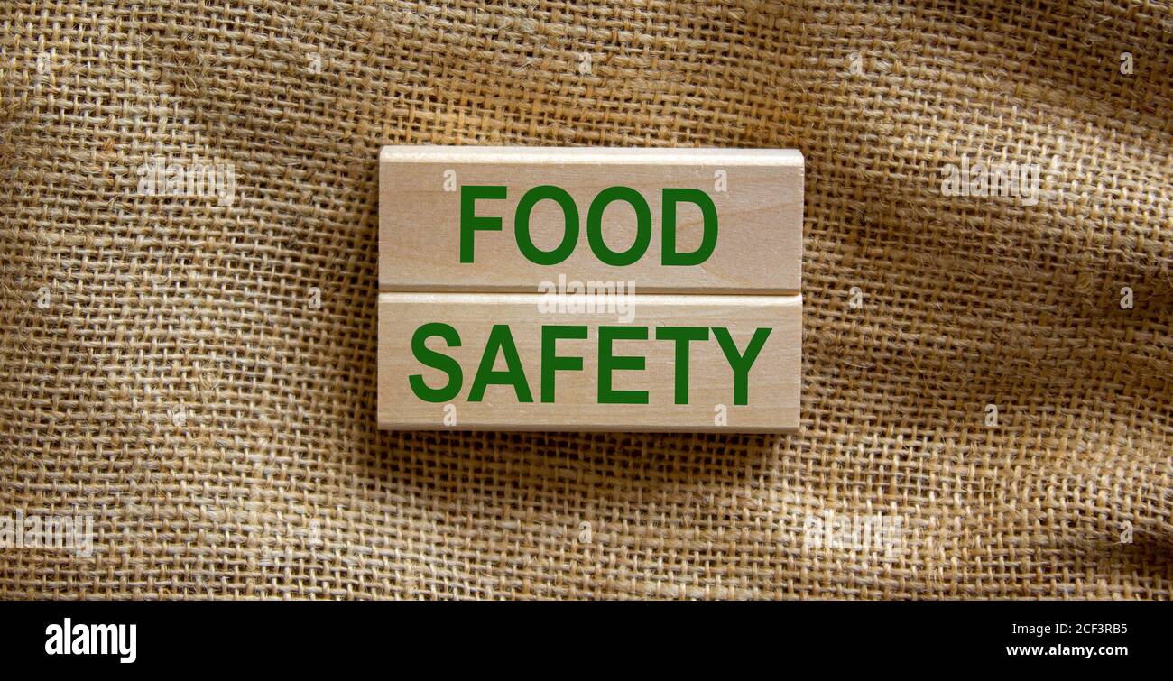 Wooden blocks form the text 'food safety' on beautiful canvas ...