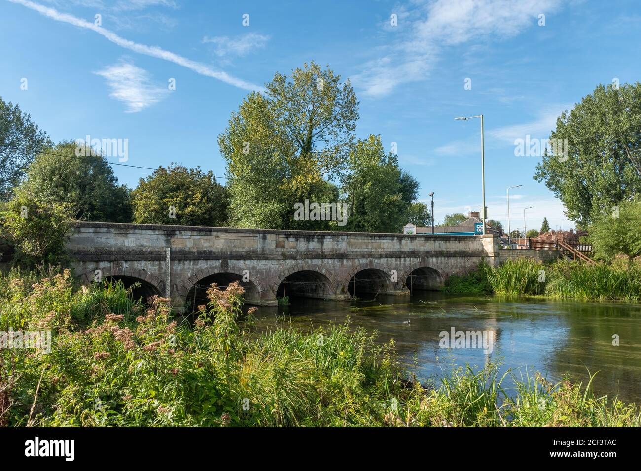 The River Kennet passing under an arched bridge at Hungerford ...
