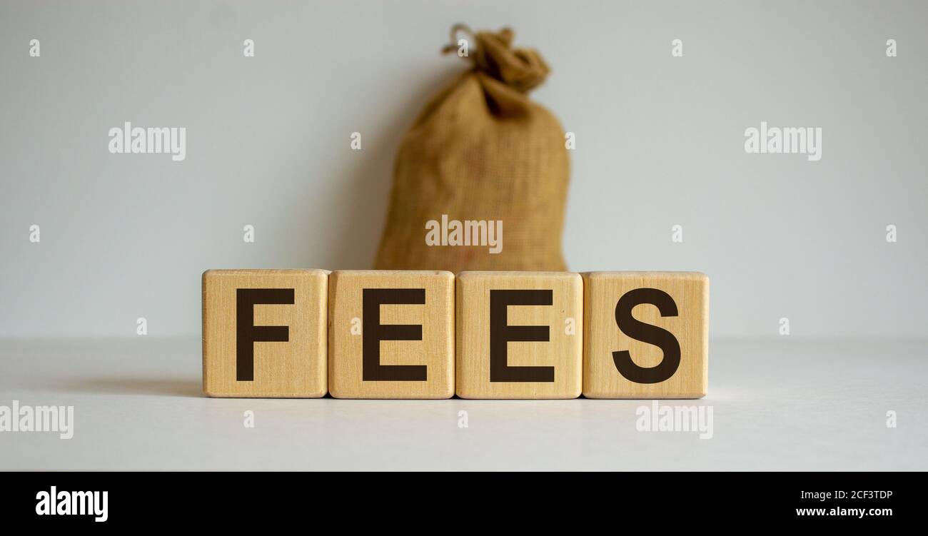 Concept word 'fees' on cubes on a beautiful wooden table. Large canvas ...