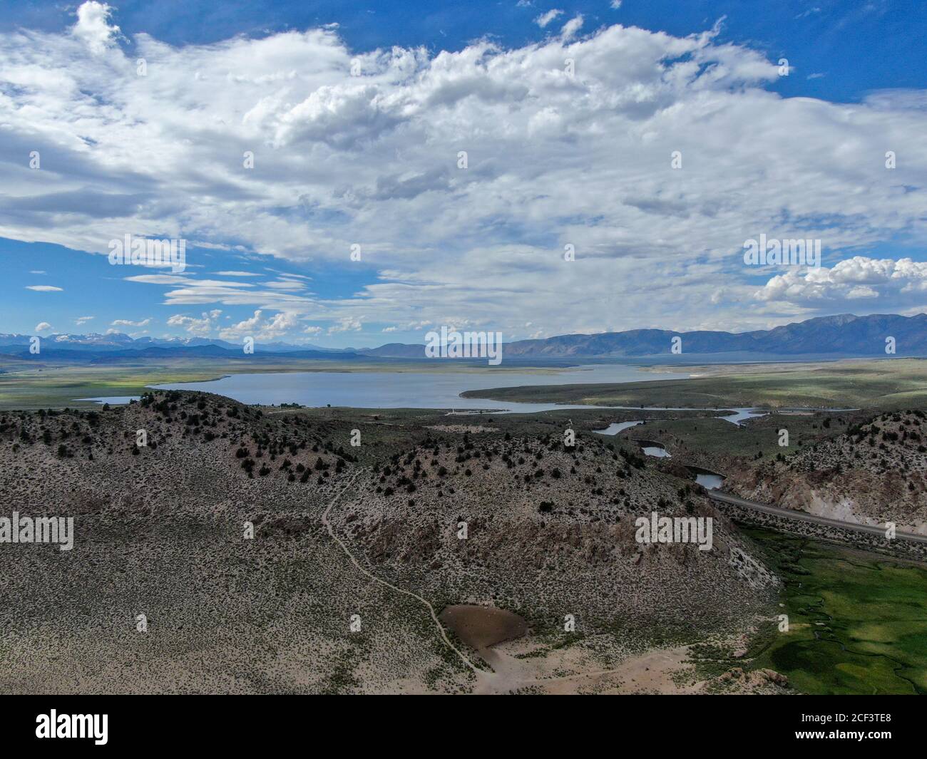 Aerial view of Lake Crowley over the mountain during hot summer day ...