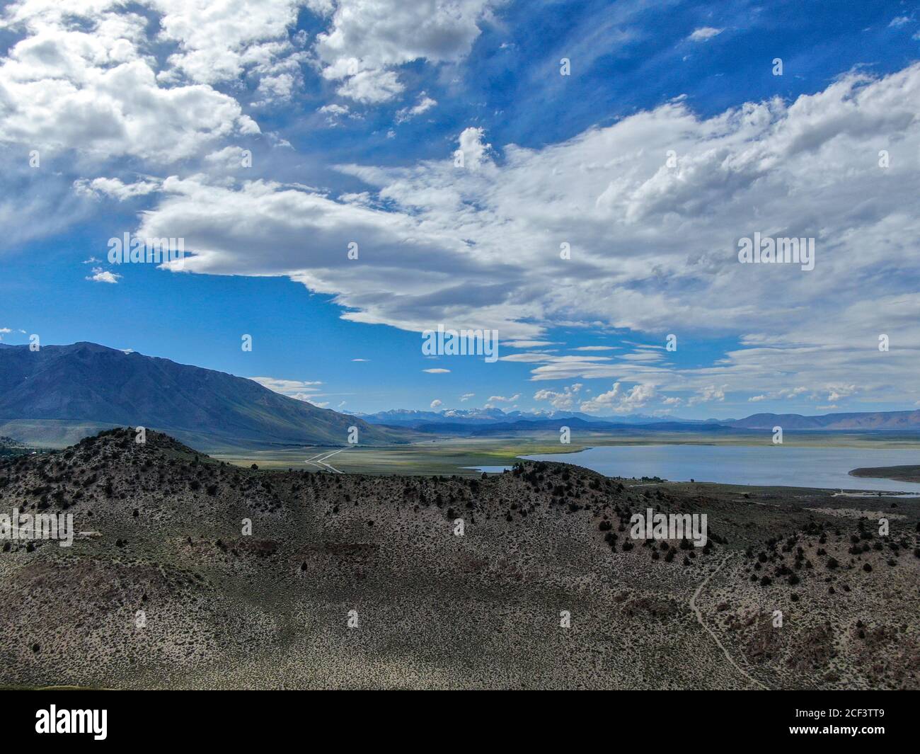 Aerial view of Lake Crowley over the mountain during hot summer day ...