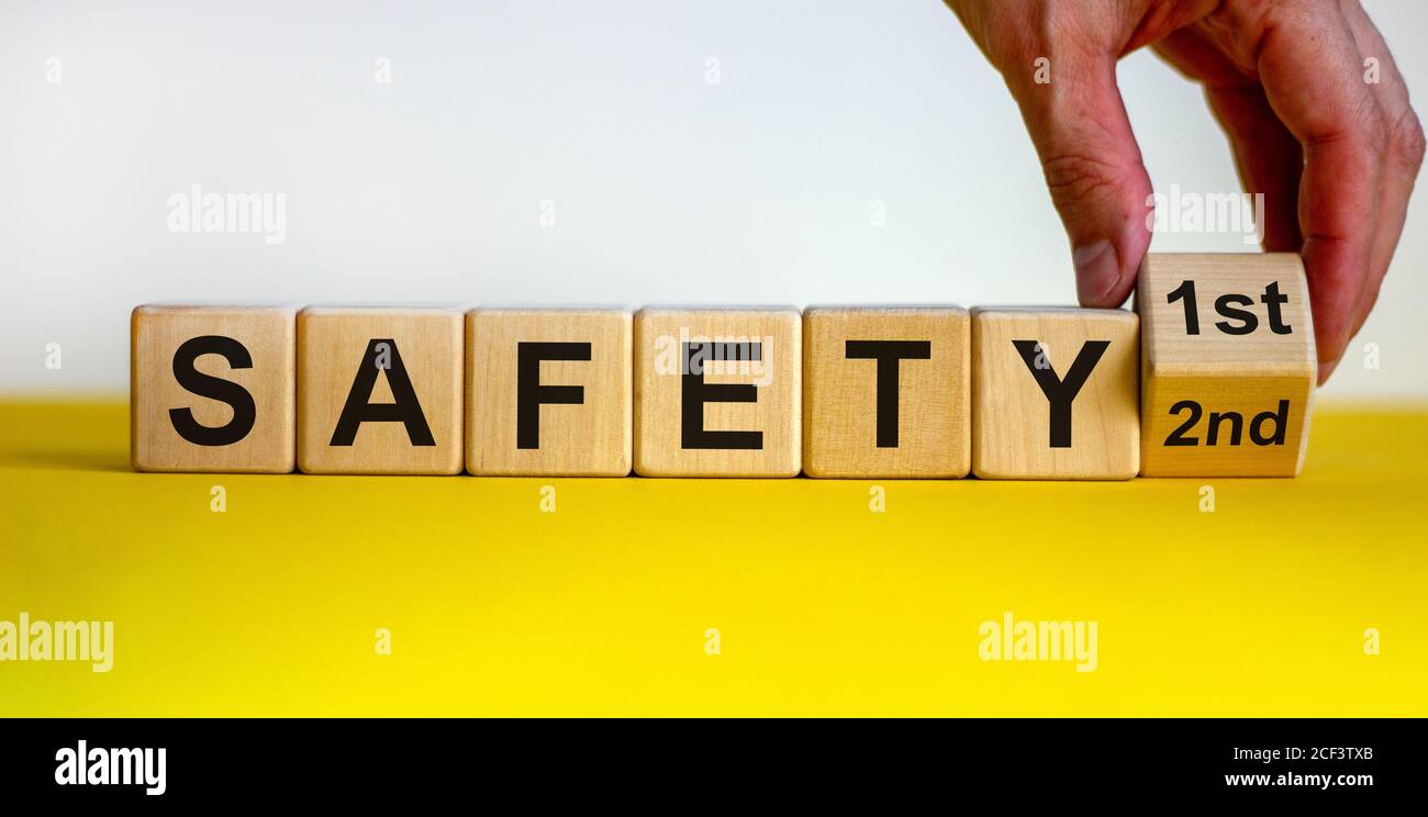 Hand turns a cubes and changes the expression 'safety second' to ...