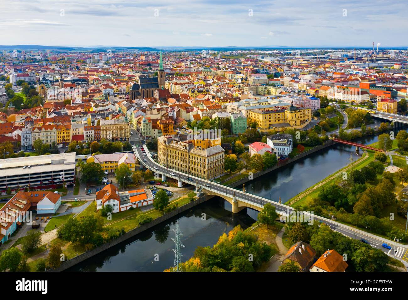 Picturesque aerial view of old buildings of Pilsen cityscape with river ...