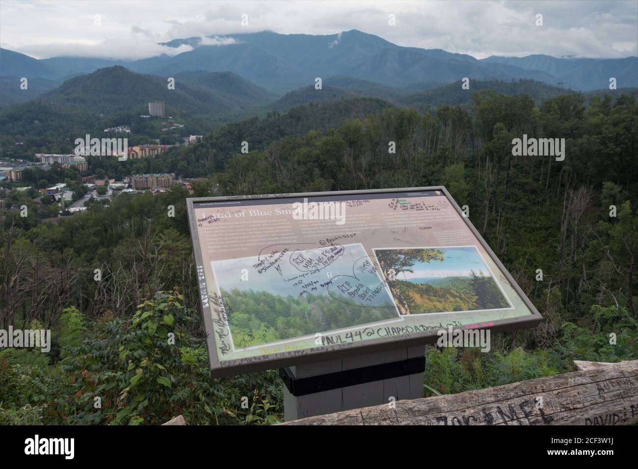 A graffiti covered informational sign at a viewpoint above Gatlinburg ...
