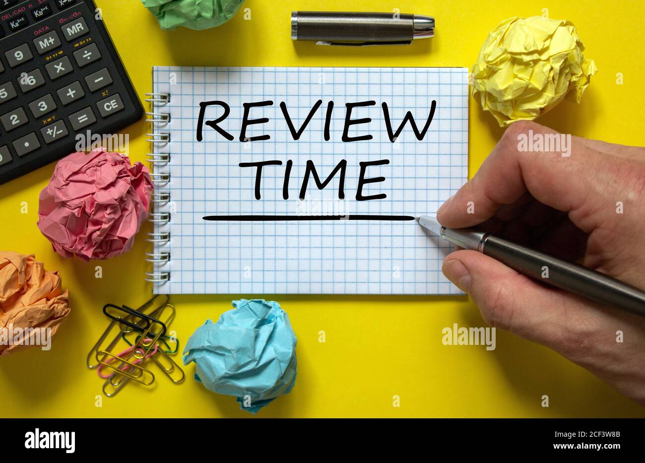 Mail hand writing 'review time' on white note, beautiful yellow ...
