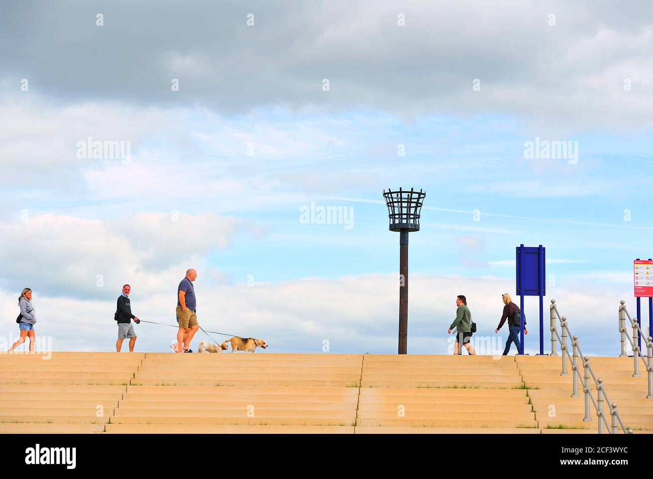 People walking on the new seawall at Lytham Stock Photo - Alamy
