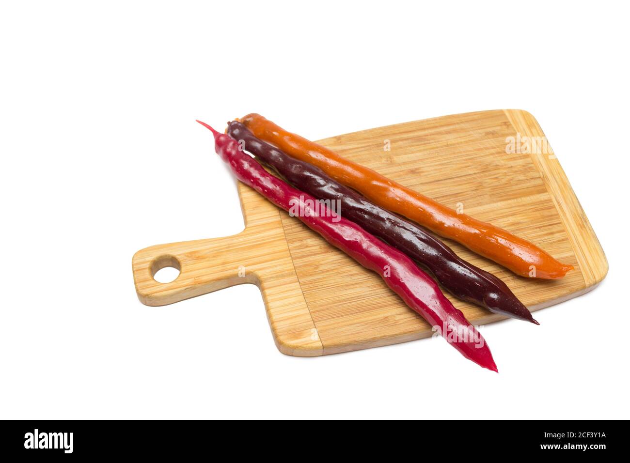 Churchkhela on a wooden board isolated on white background, ancient ...