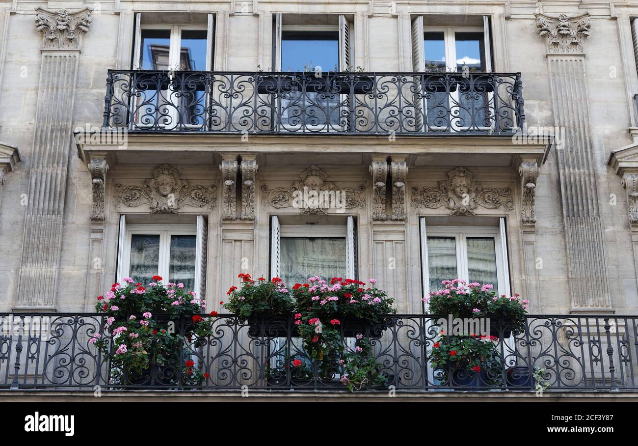 Traditional French house with typical balconies and windows. Paris ...