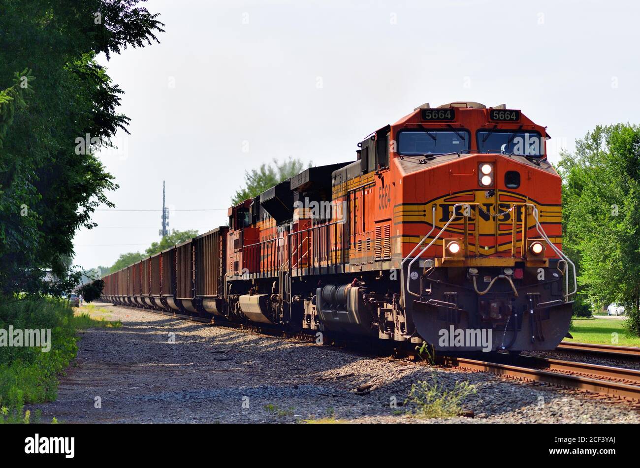 Chesterton, Indiana, USA. Burlington Northern Santa Fe locomotives power an empty coal train on ...