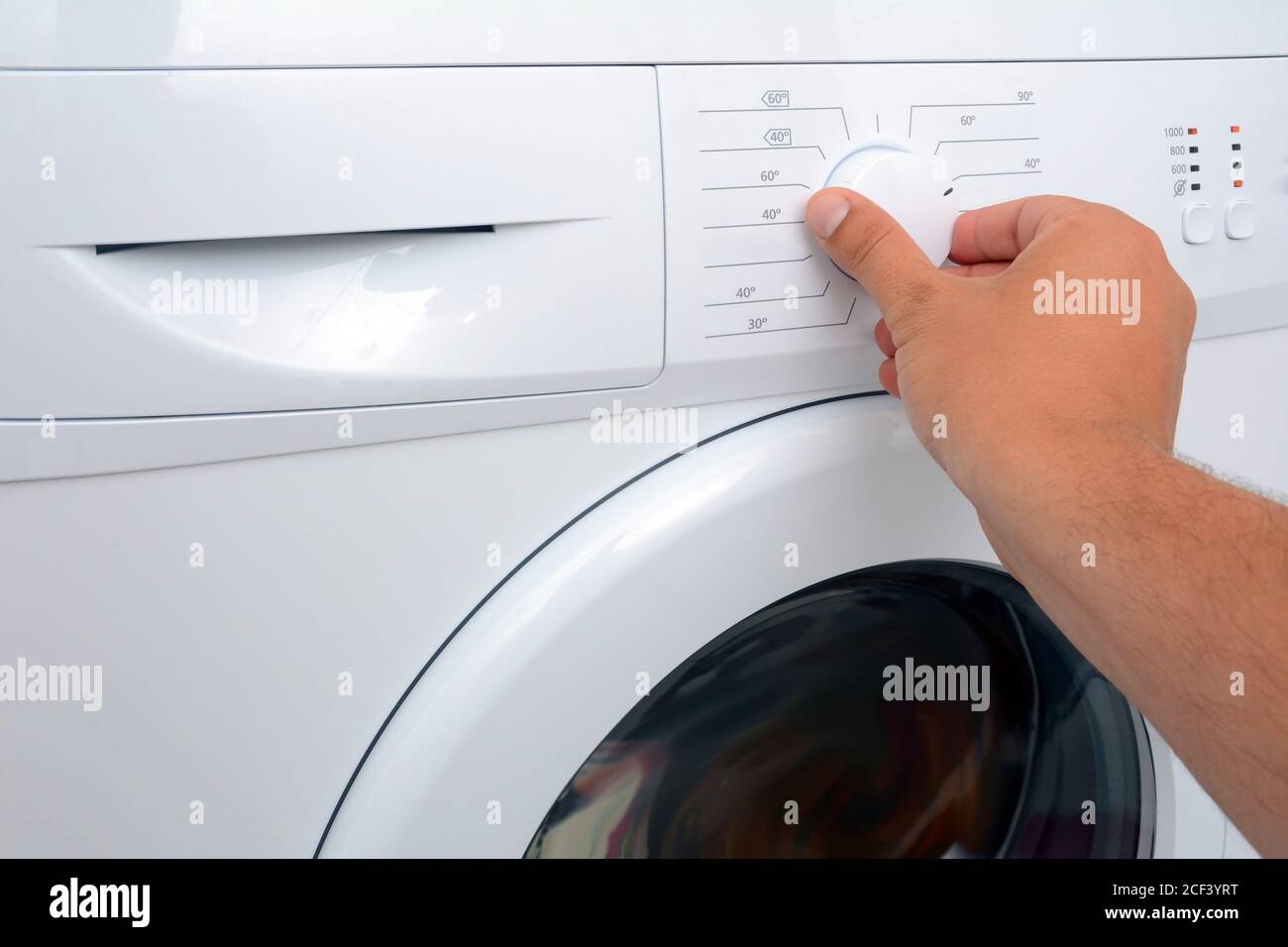 Start button on washing machine hi-res stock photography and images - Alamy