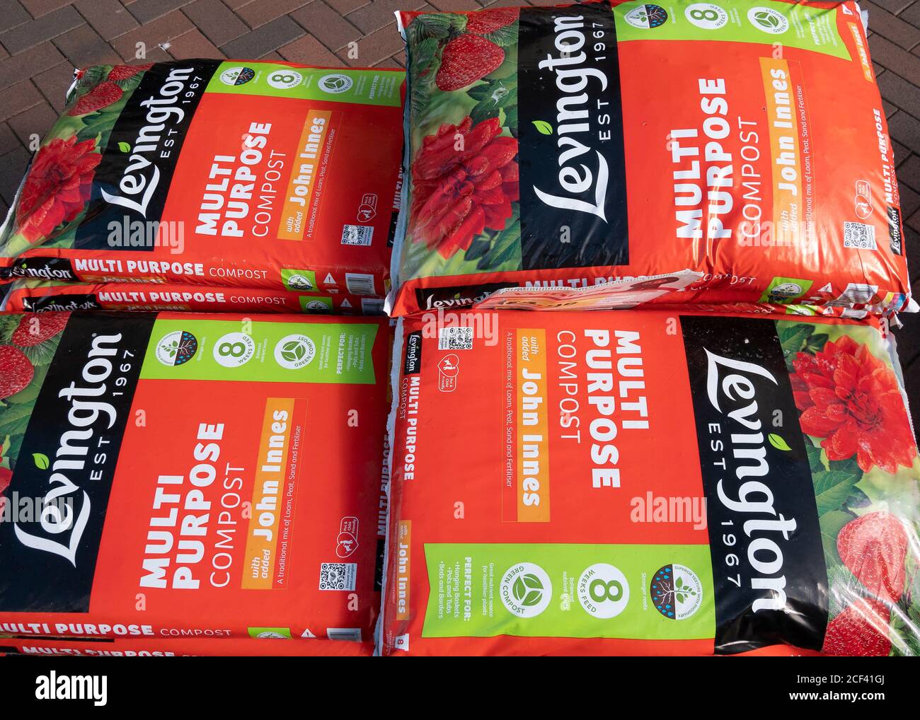 A stack of bags of Levington multi purpose Compost in a garden centre ...