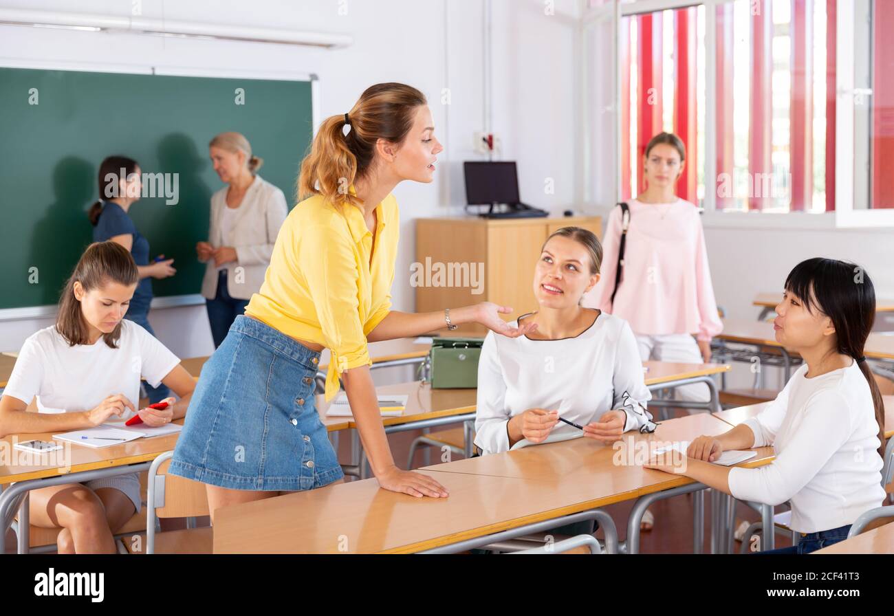 Students talking and having fun, spending time together during recess ...
