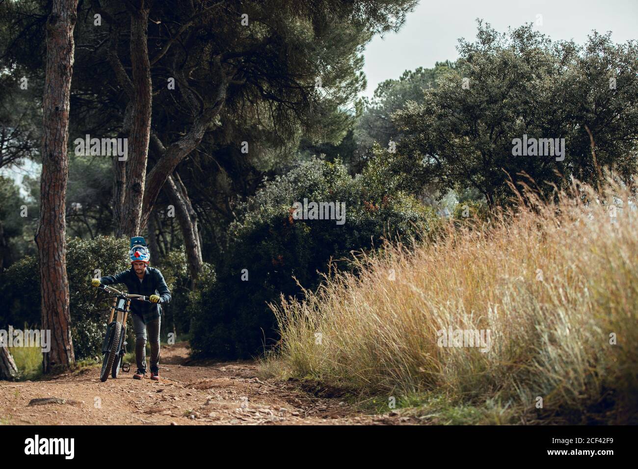 Man walking with helmet hi-res stock photography and images - Alamy
