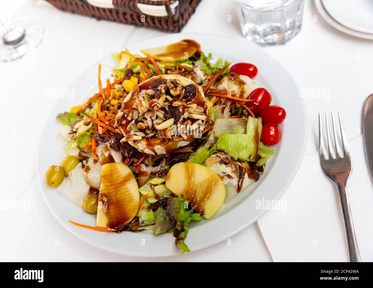 Appetizing salad with goat cheese served on plate. Spanish cuisine ...