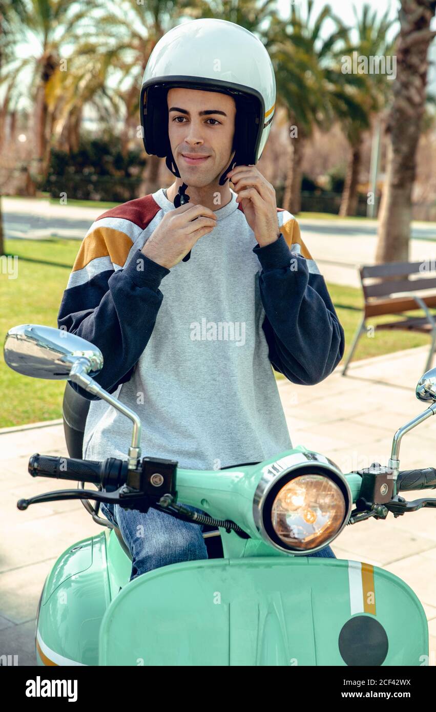 Adjusting helmet hi-res stock photography and images - Alamy