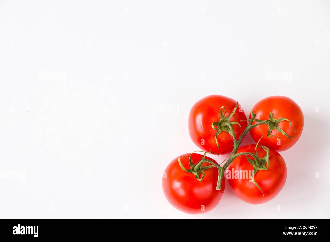 Four colorful red tomatoes hi-res stock photography and images - Alamy