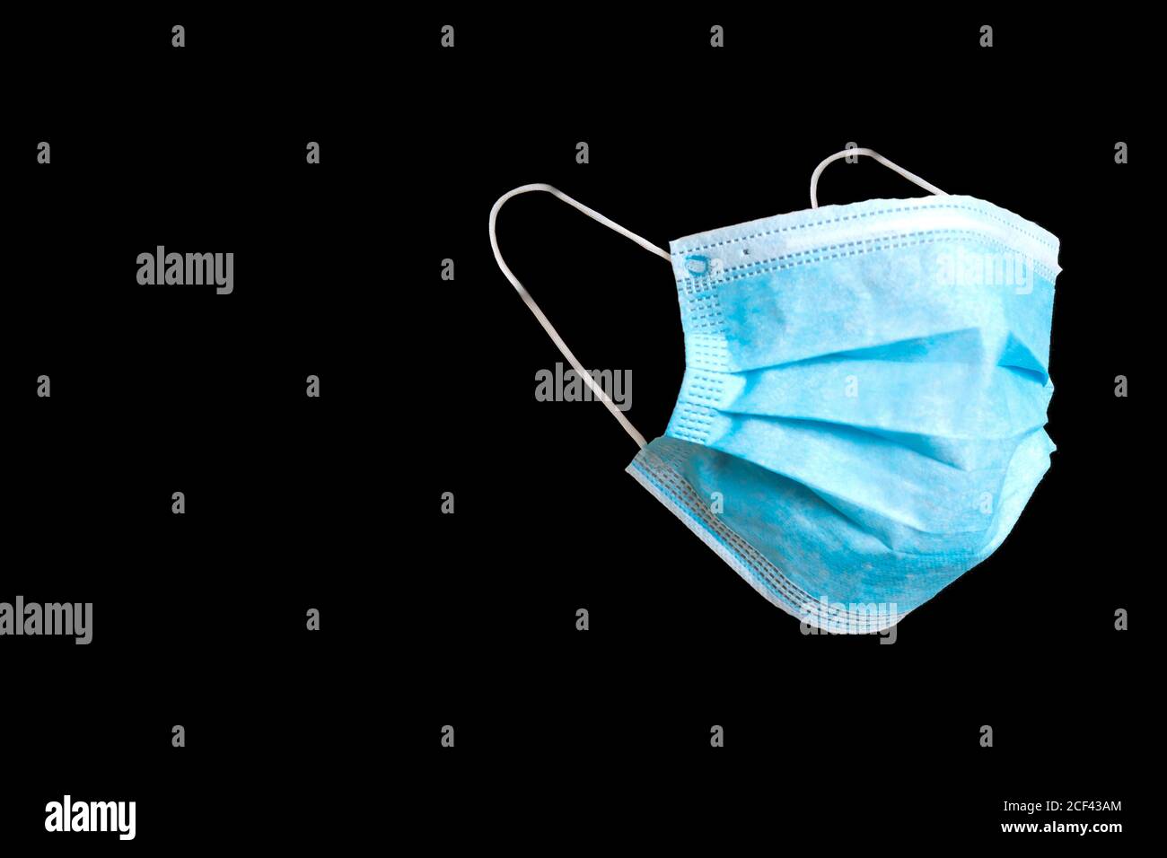 Protective face mask on black background Stock Photo - Alamy