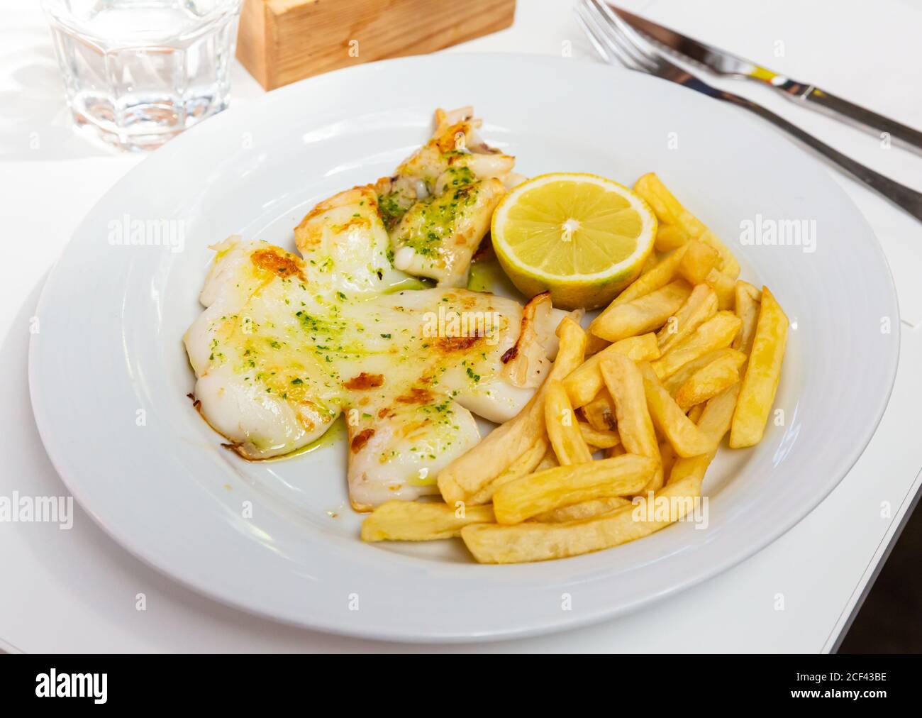 Image of delicious grilled cuttlefish on plate, served with french ...