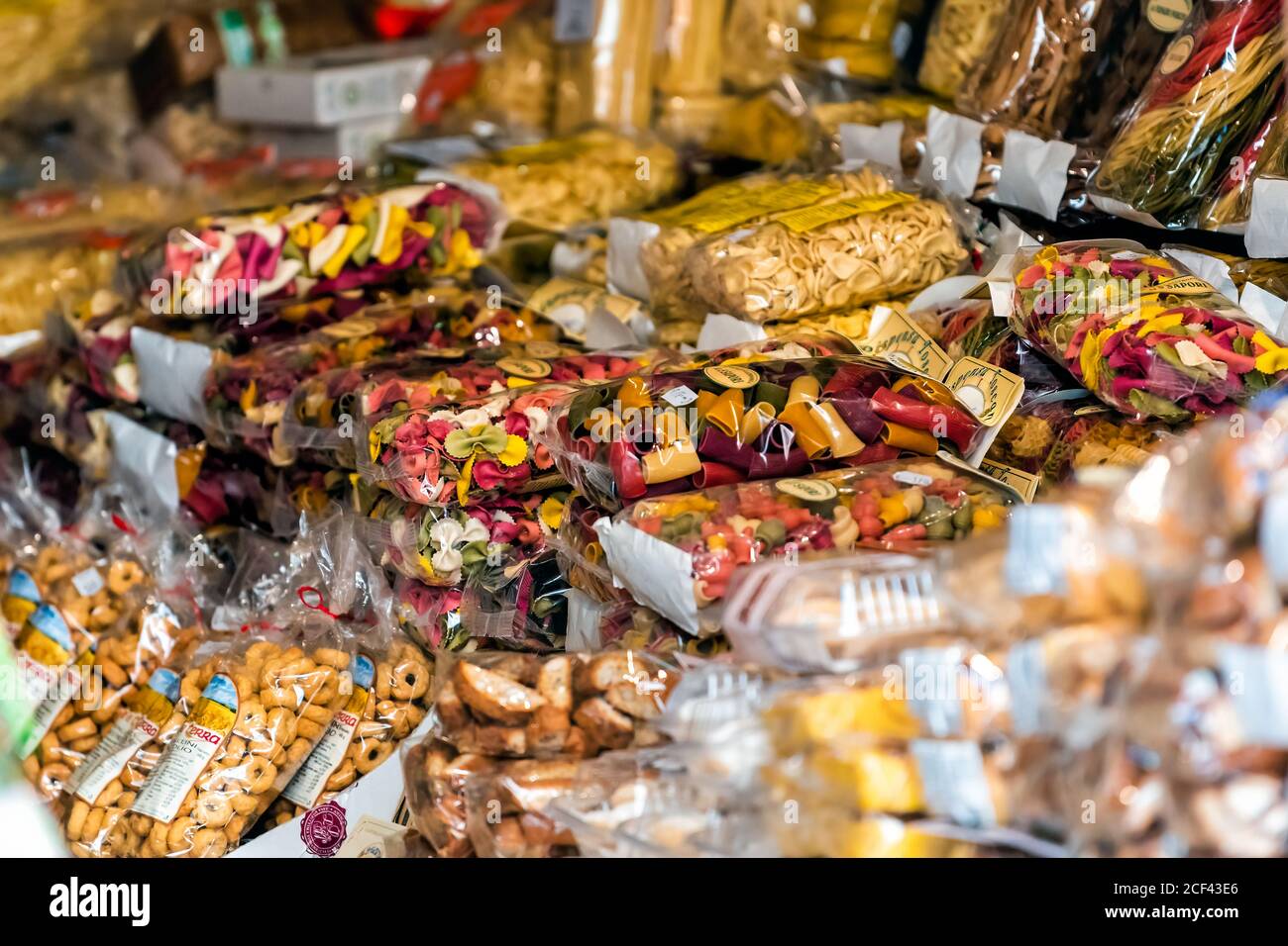 San Gimignano, Italy - August 27, 2018: Italian packaged colorful pasta ...