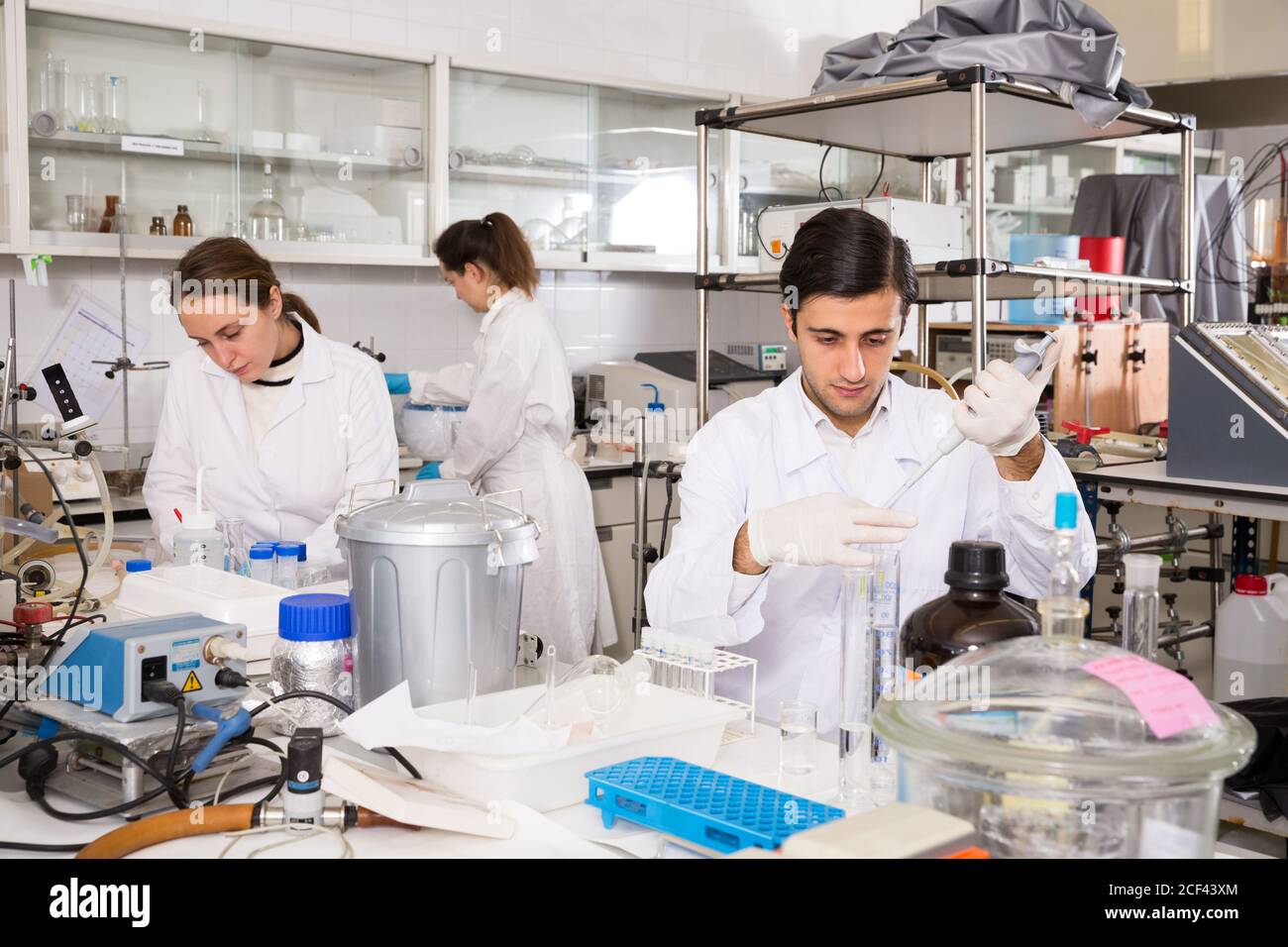 Intelligent student performing experiments in university laboratory ...