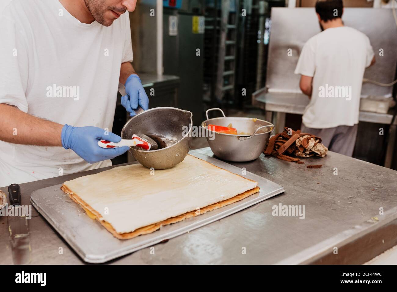 Unrecognizable crop cook spreading butter hi-res stock photography and ...