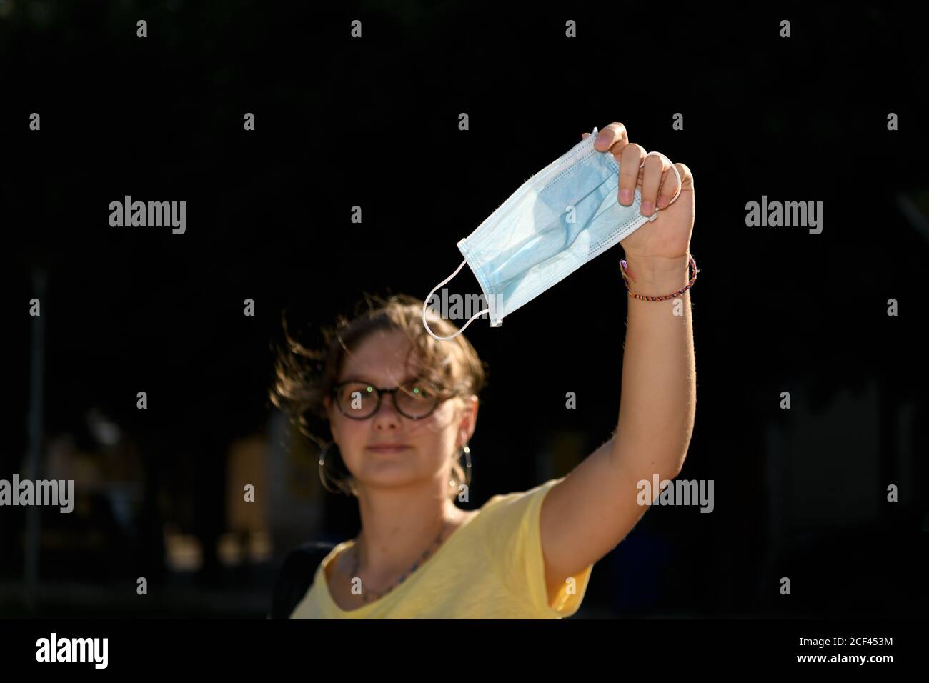 Happy positive girl with glasses, young beautiful woman takes off ...