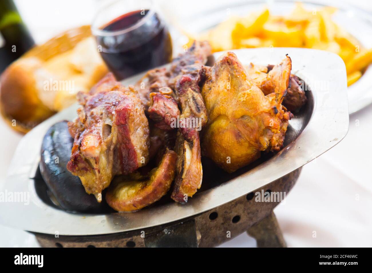 Traditional Argentinian dish asado served at dinner with wine Stock ...