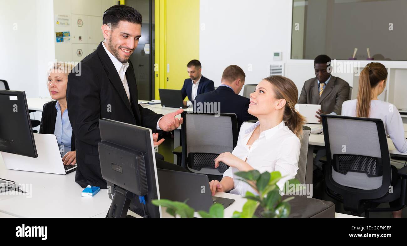 Happy employees open plan office hi-res stock photography and images ...