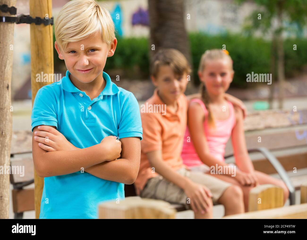 Child standing alone in playground hi-res stock photography and images ...