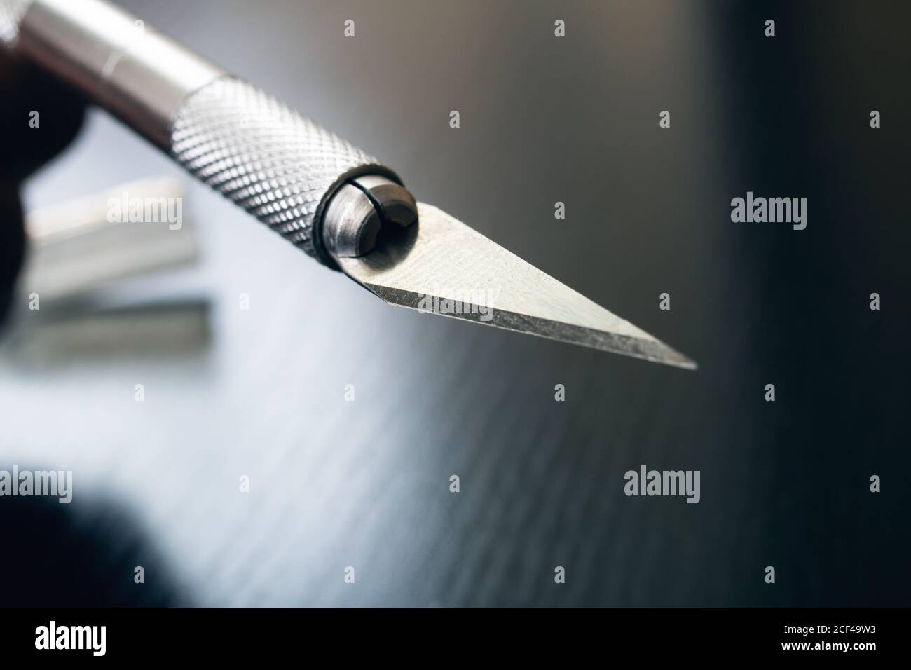 Sharp blade of a metal scalpel closeup Stock Photo - Alamy