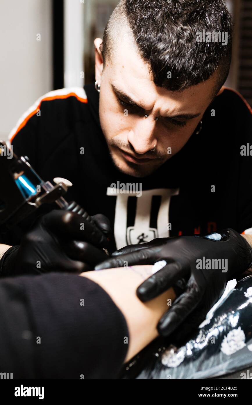 Body piercing procedure hi-res stock photography and images - Alamy
