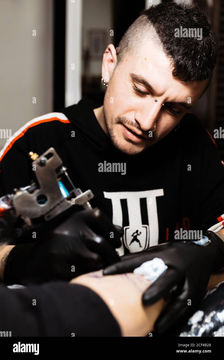 Body piercing procedure hi-res stock photography and images - Alamy