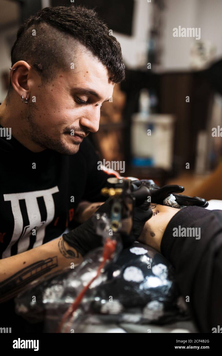 Body piercing procedure hi-res stock photography and images - Alamy