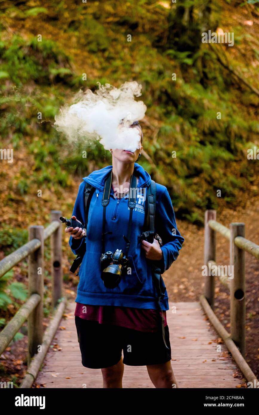 Woman smoking cigarette forest hi-res stock photography and images - Alamy