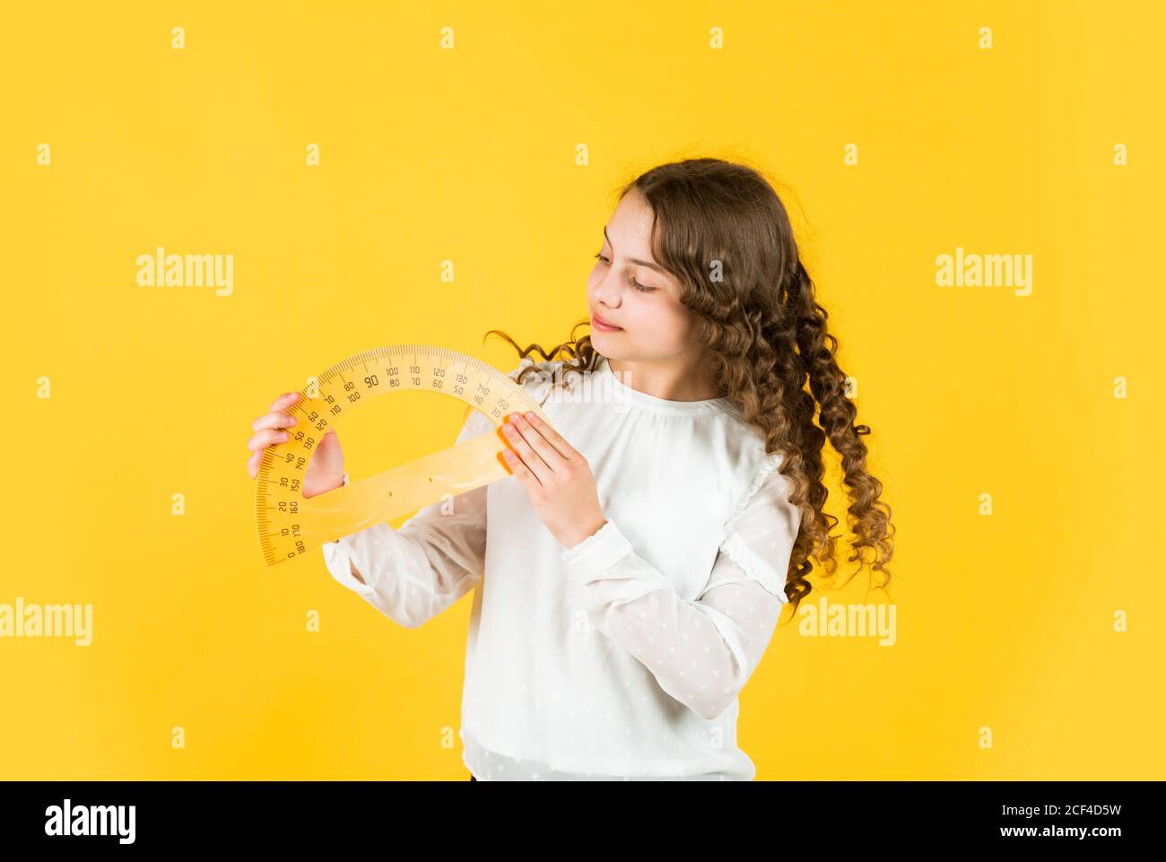 School lessons. Adorable cute pupil. She loves studying. Small girl ...