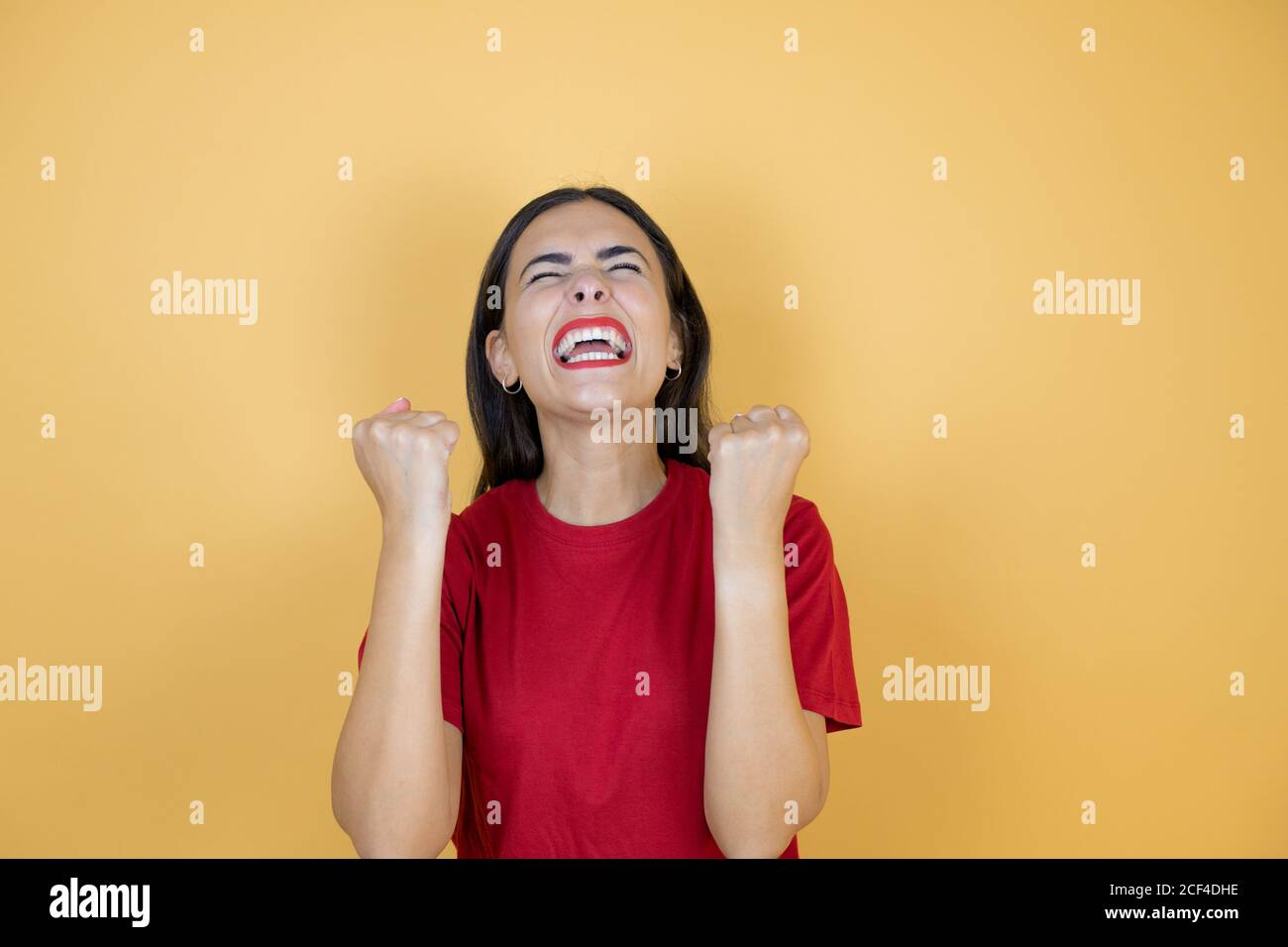 Young beautiful woman over isolated yellow background very happy and ...