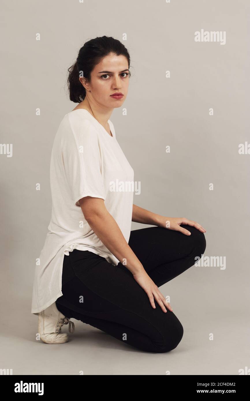 Crouching pensive hi-res stock photography and images - Alamy