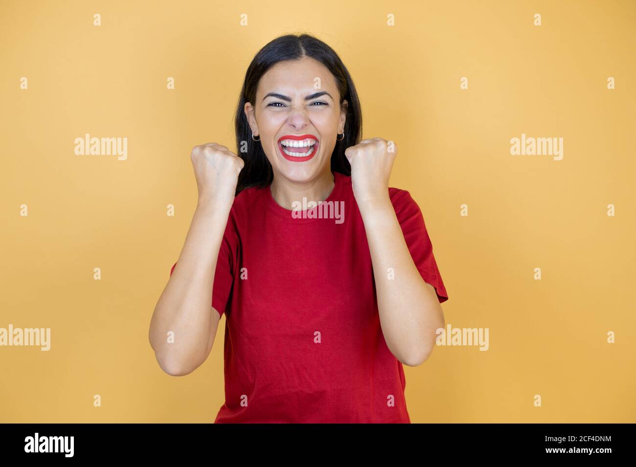Young beautiful woman over isolated yellow background very happy and ...