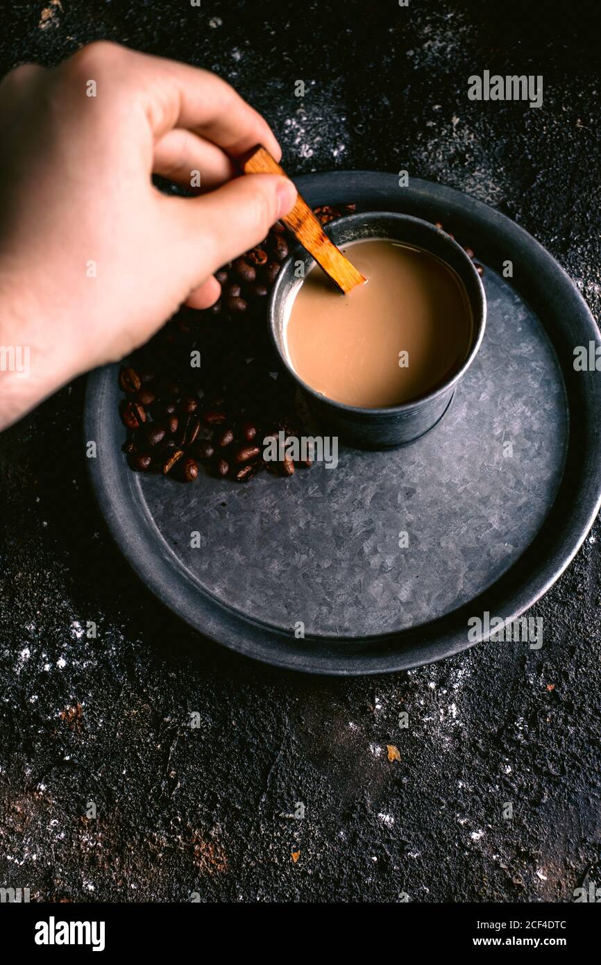Hand stirring hot coffee hi-res stock photography and images - Alamy