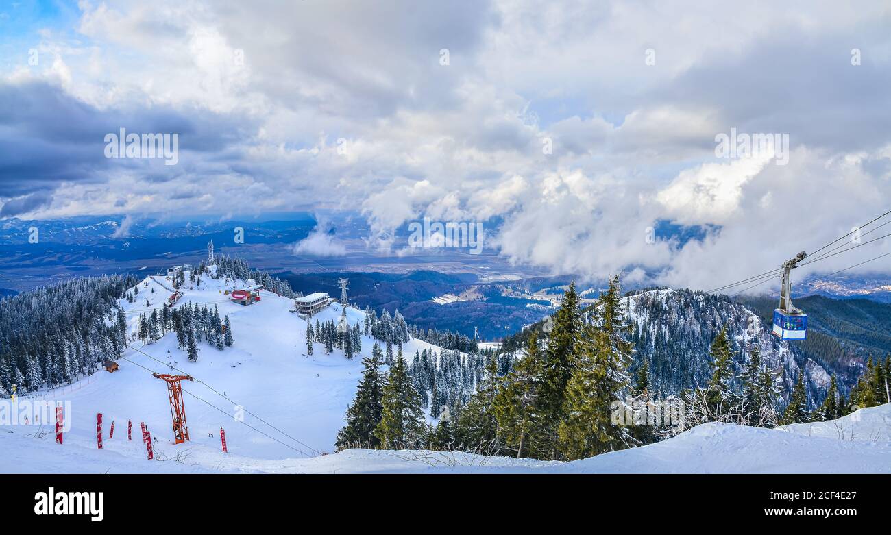 Landscape from top of Postavaru mountain with ski slopes and cable car ...