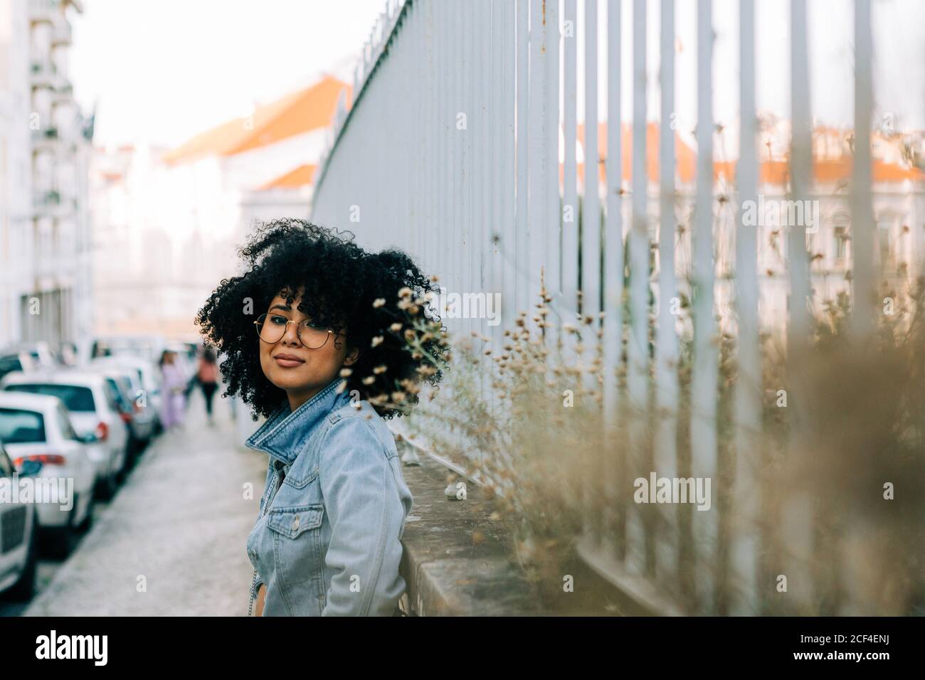 Side view cheerful african american woman denim jacket standing ...