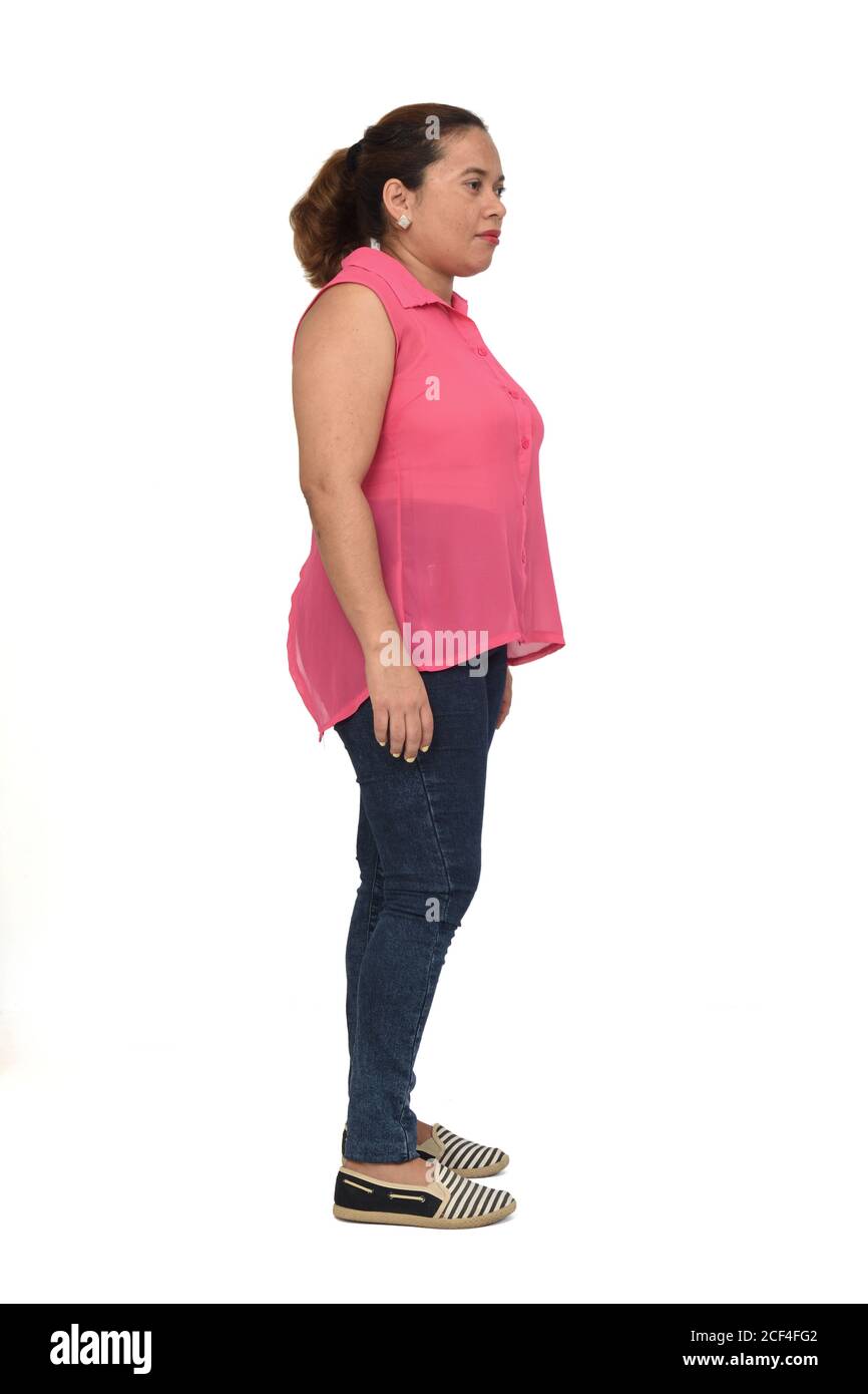 full portrait of woman standing and side view and looking side on white ...