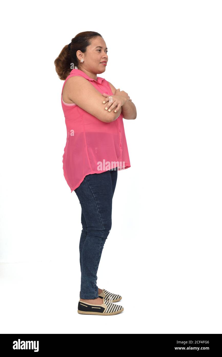 full portrait of woman standing and side view and looking side on white ...