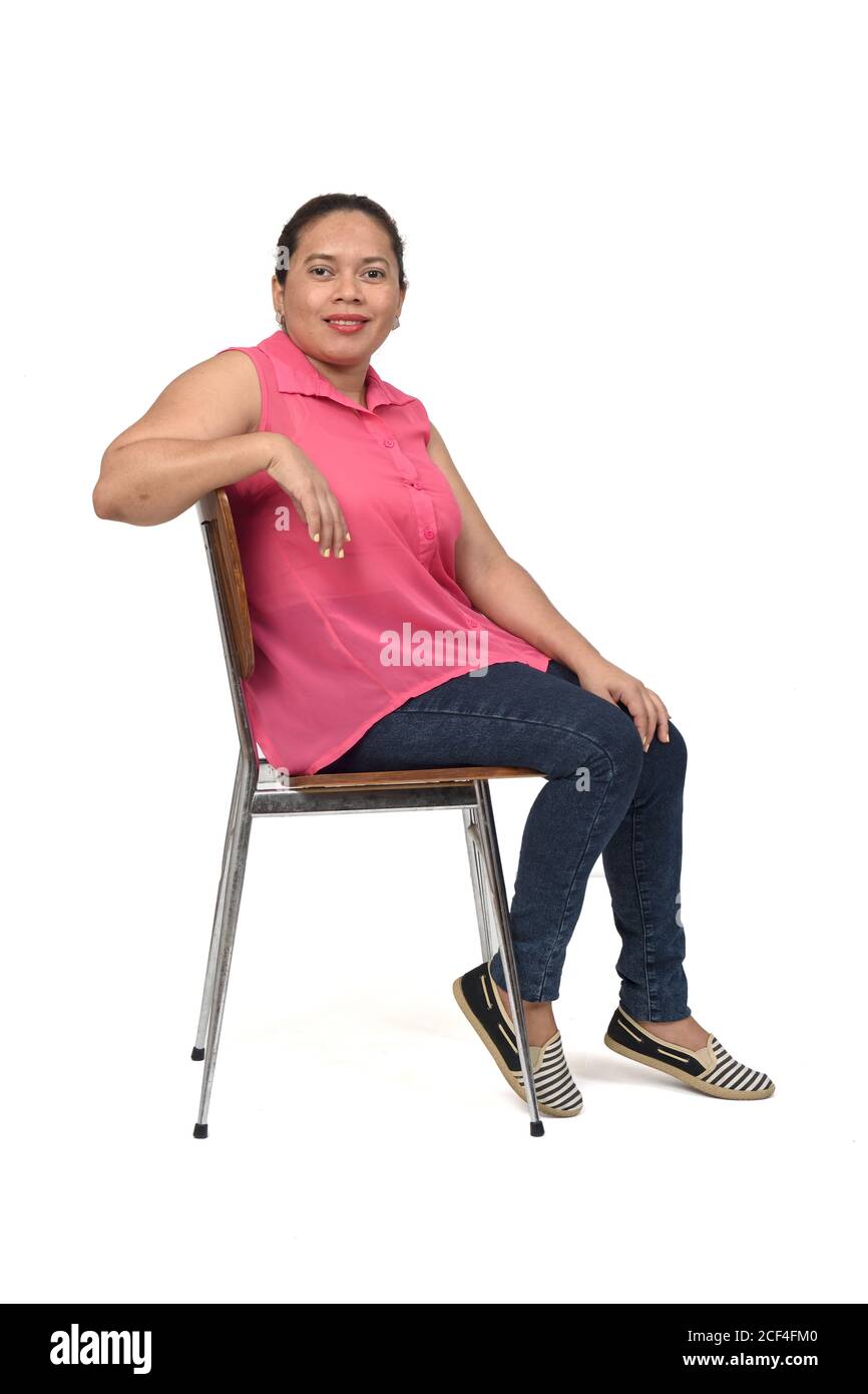 portrait of a woman sitting on a chair with the body in profile and ...